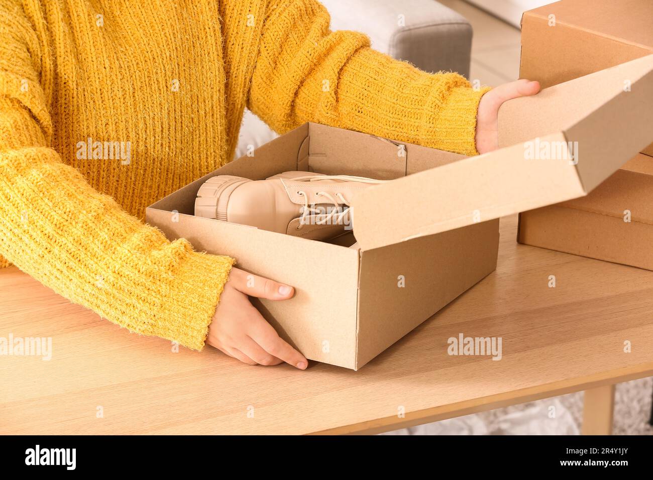 Lady opening box new hi-res stock photography and images - Alamy