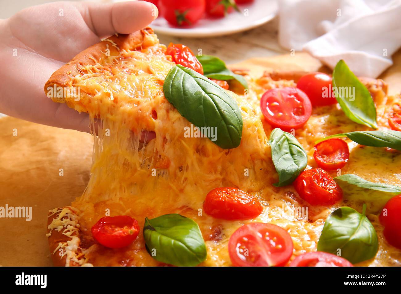Hand taking crispy cheese pizza hi-res stock photography and images - Alamy