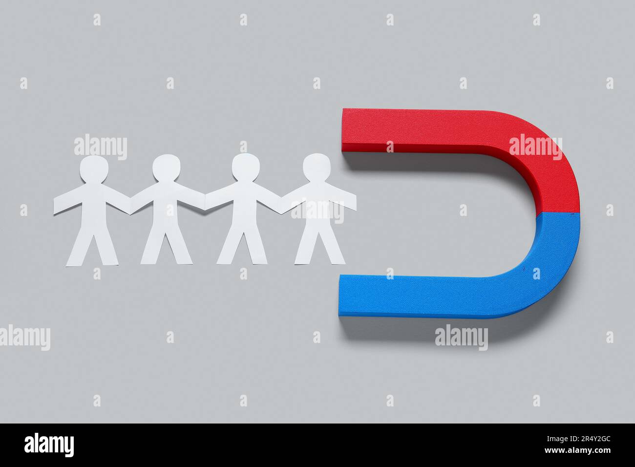 Magnet attracting group of employees on white background. Recruitment ...