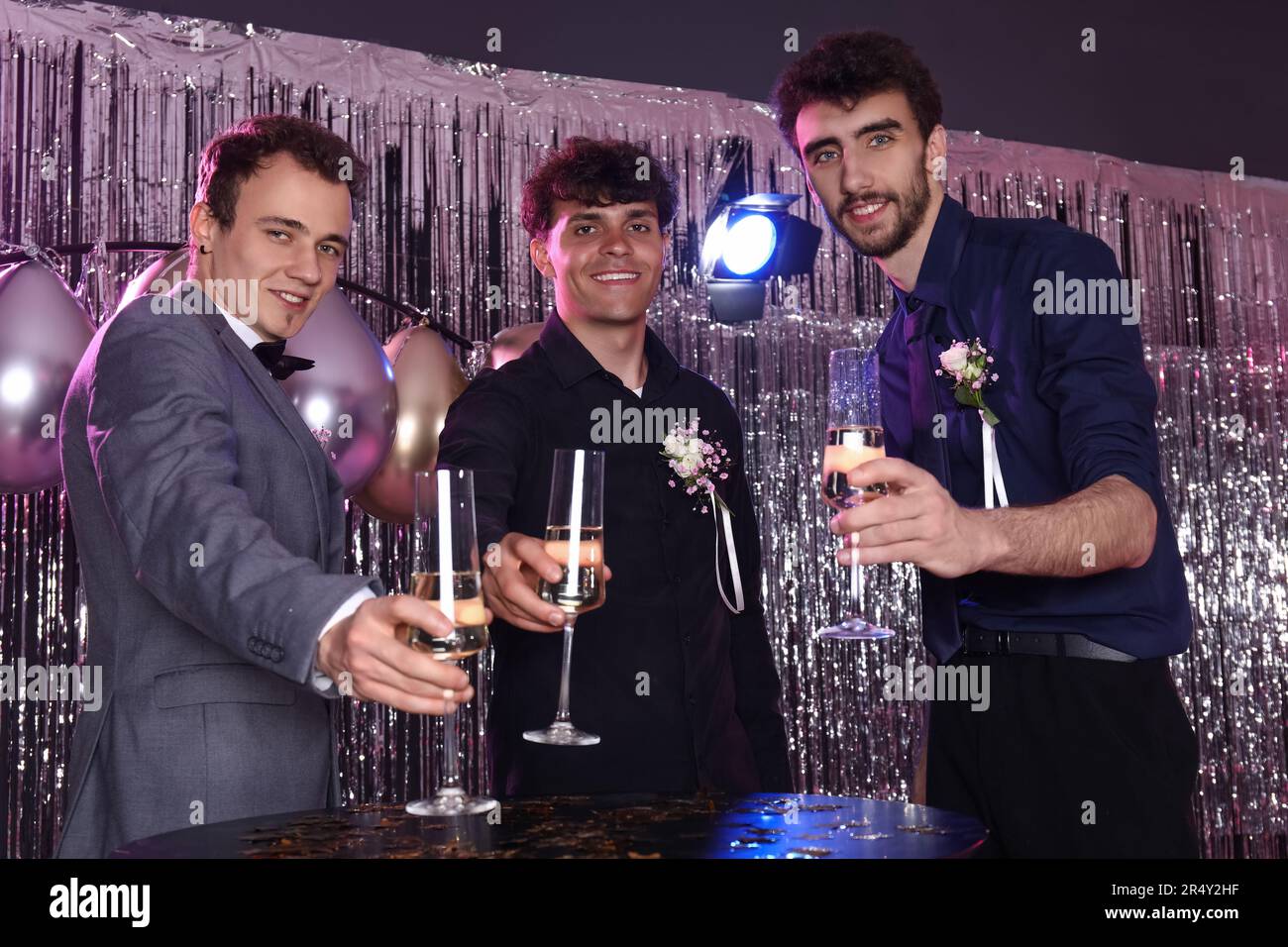 Young men drinking champagne on prom night Stock Photo - Alamy