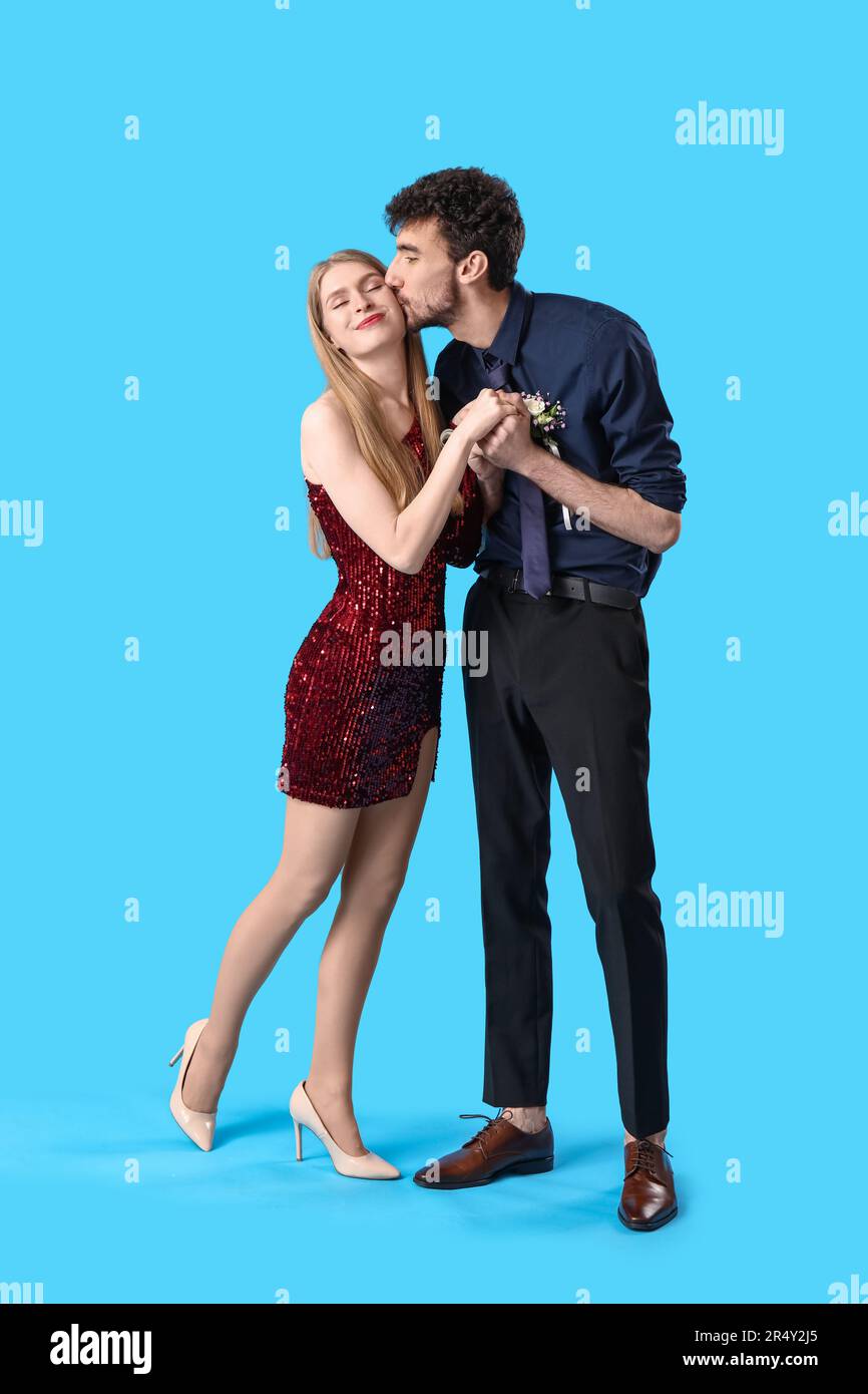Beautiful prom couple on blue background Stock Photo - Alamy