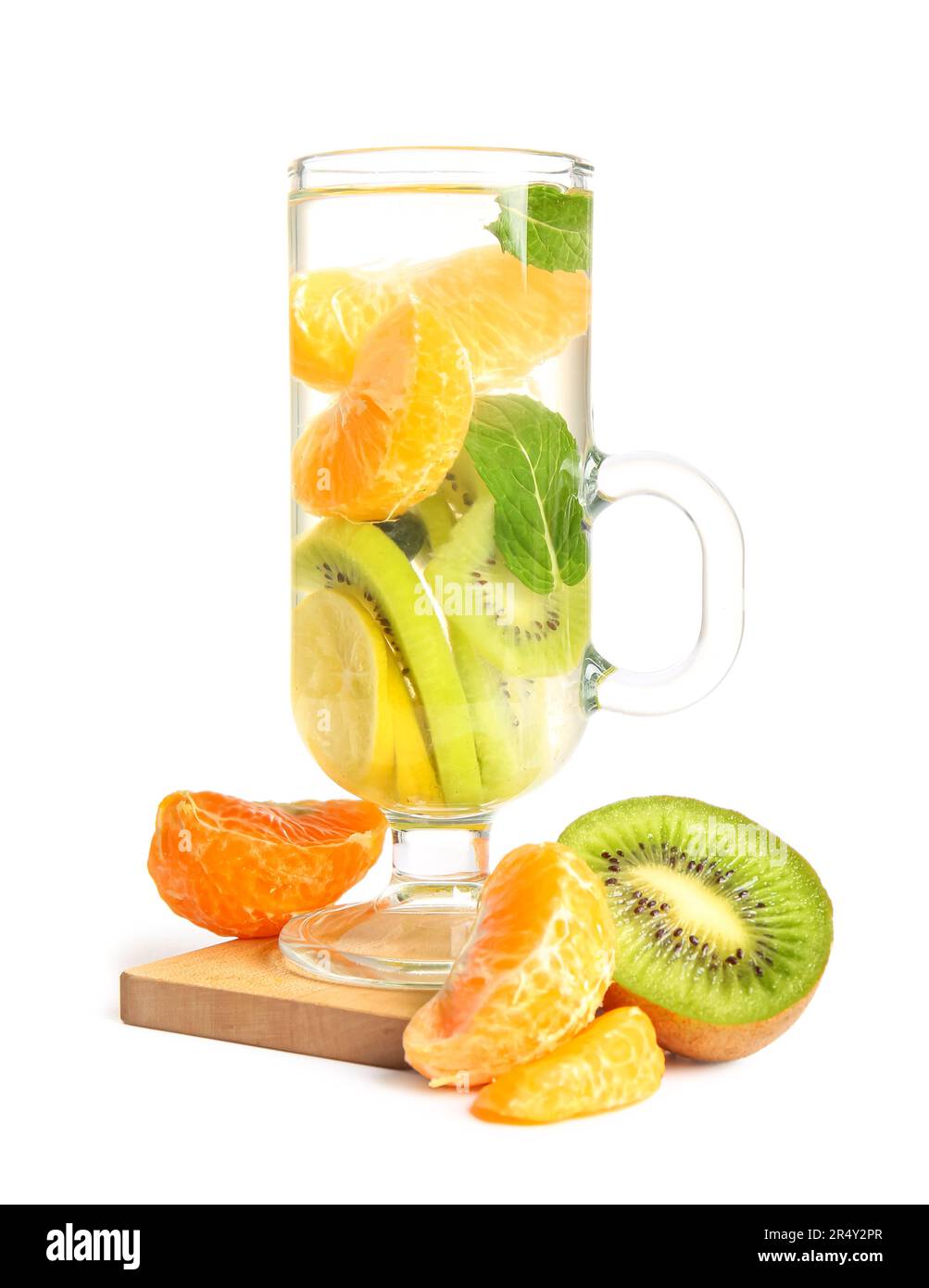 Glass of infused water with different sliced fruits on white background ...