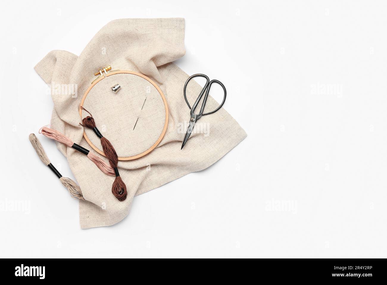 Embroidery hoop with canvas, scissors and mouline threads isolated on ...