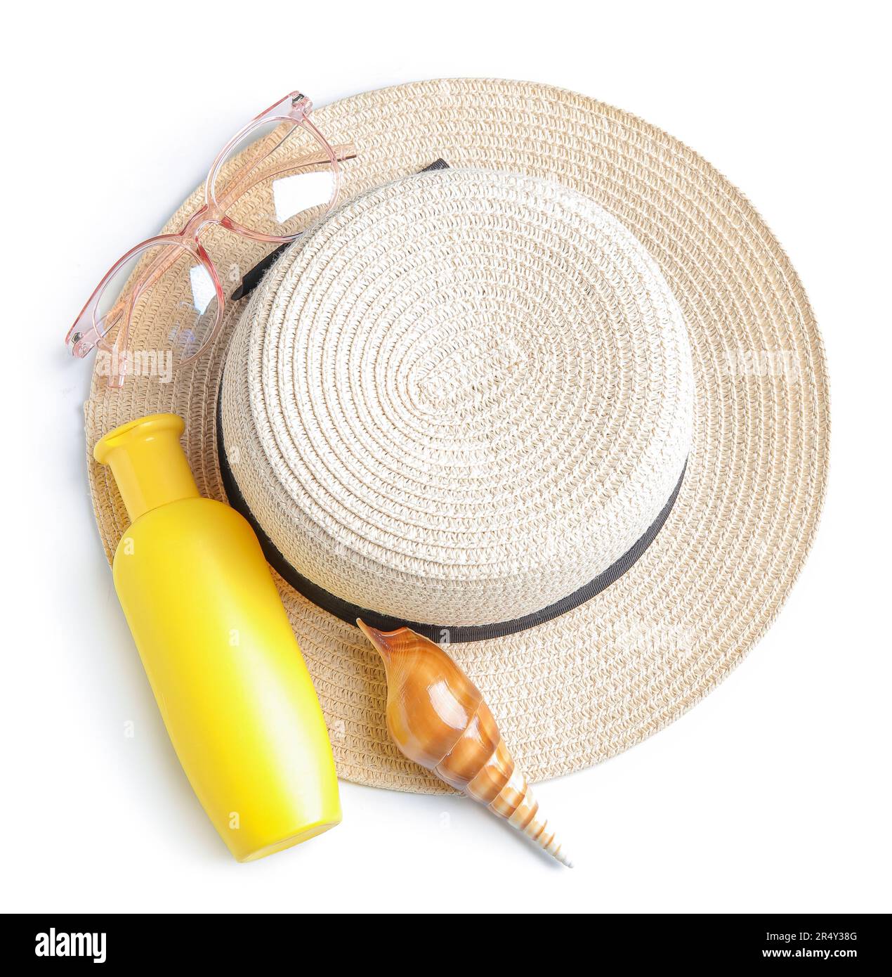 Bottle of sunscreen cream with sunglasses and summer hat isolated on ...
