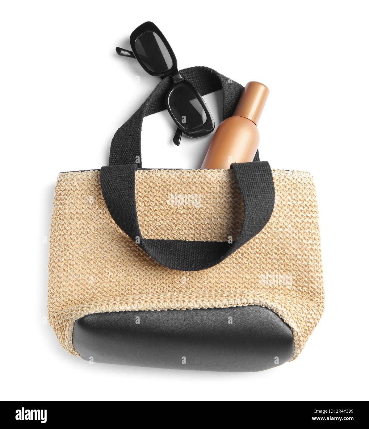 Bottle of sunscreen cream with sunglasses and wicker bag isolated on ...