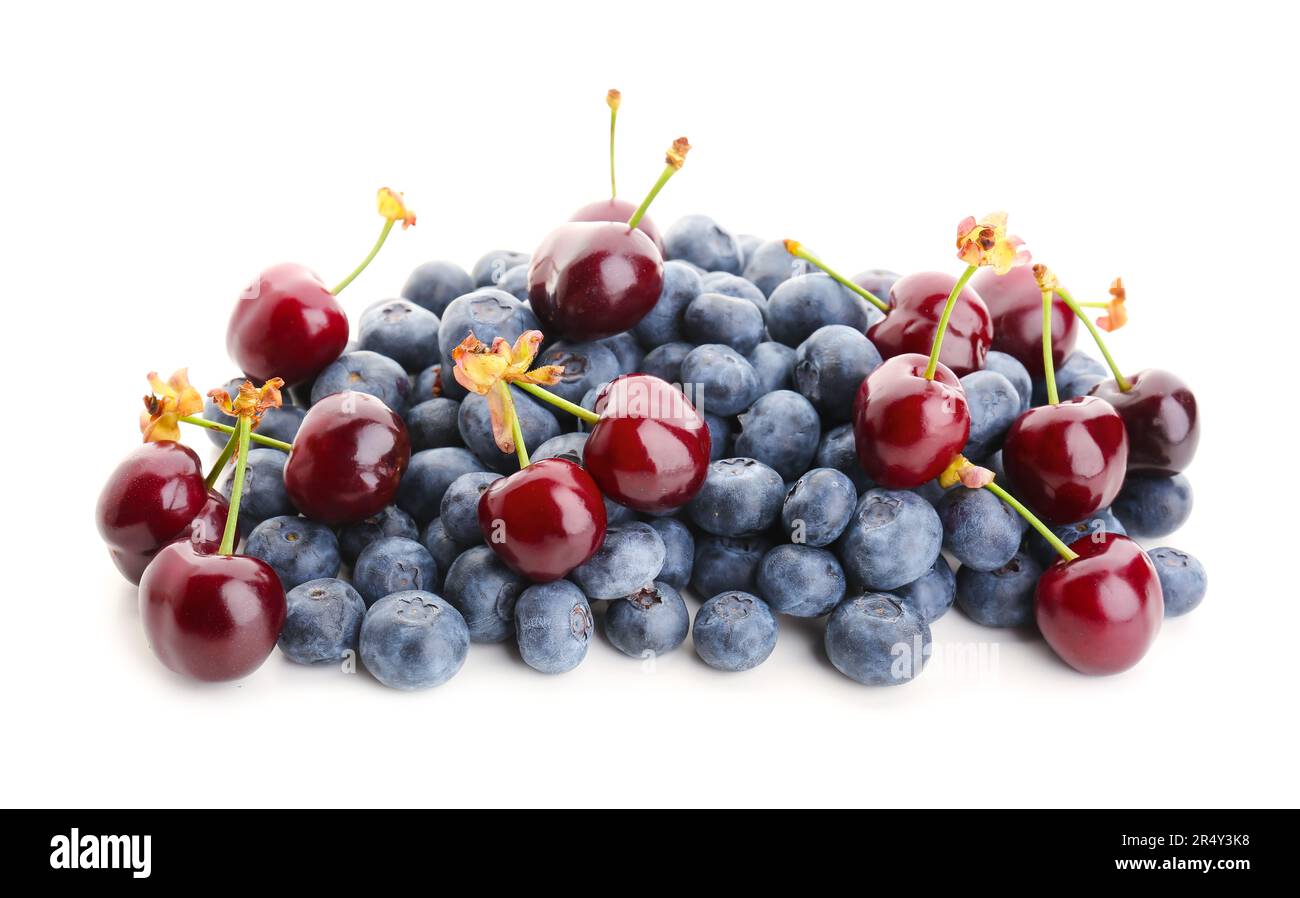Ripe cherry and blueberry on white background Stock Photo - Alamy