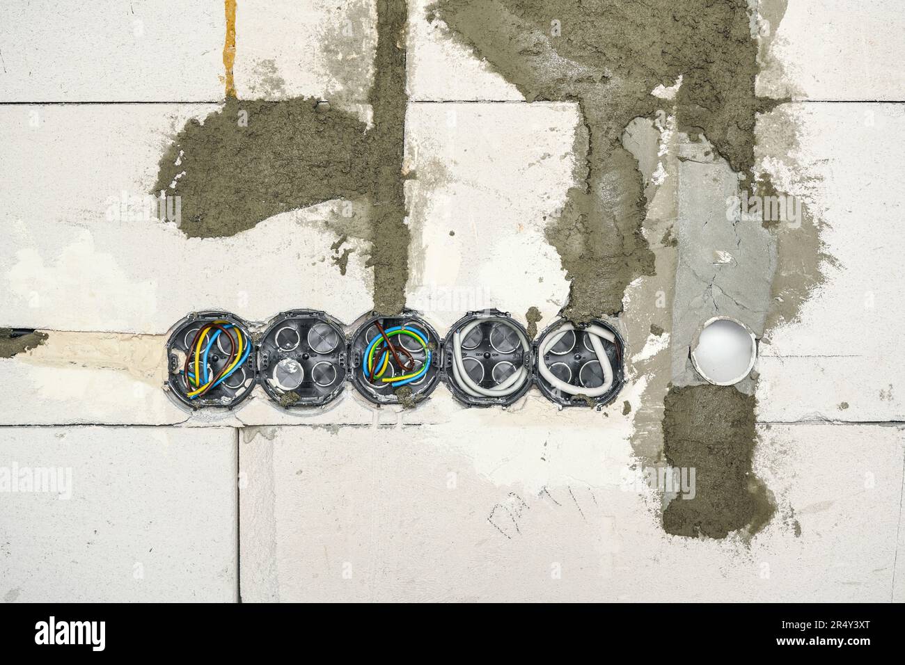 Boxes with cables for electric sockets installed in new house building ...