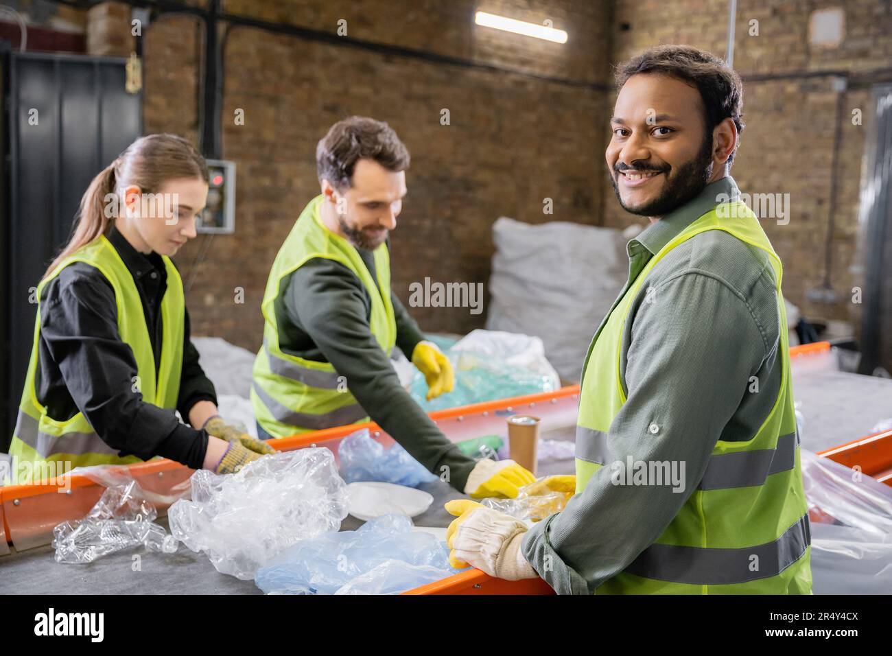 Professional conveyor workers in gloves hi-res stock photography and ...