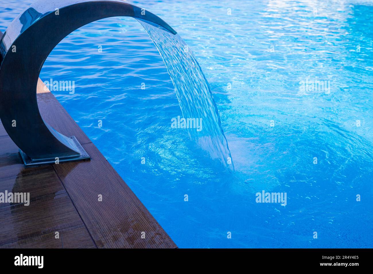 Empty Swimming pool with waterfall jet and jacuzzi in action Stock ...