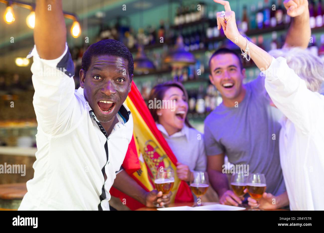 Happy diverse group celebrating Spain Stock Photo - Alamy