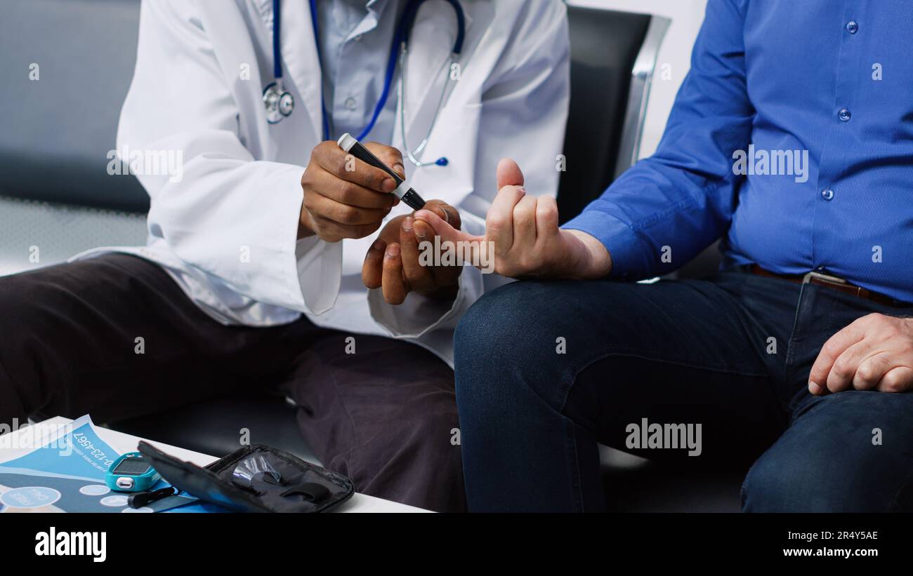 Doctor doing insulin level measurement hi-res stock photography and ...