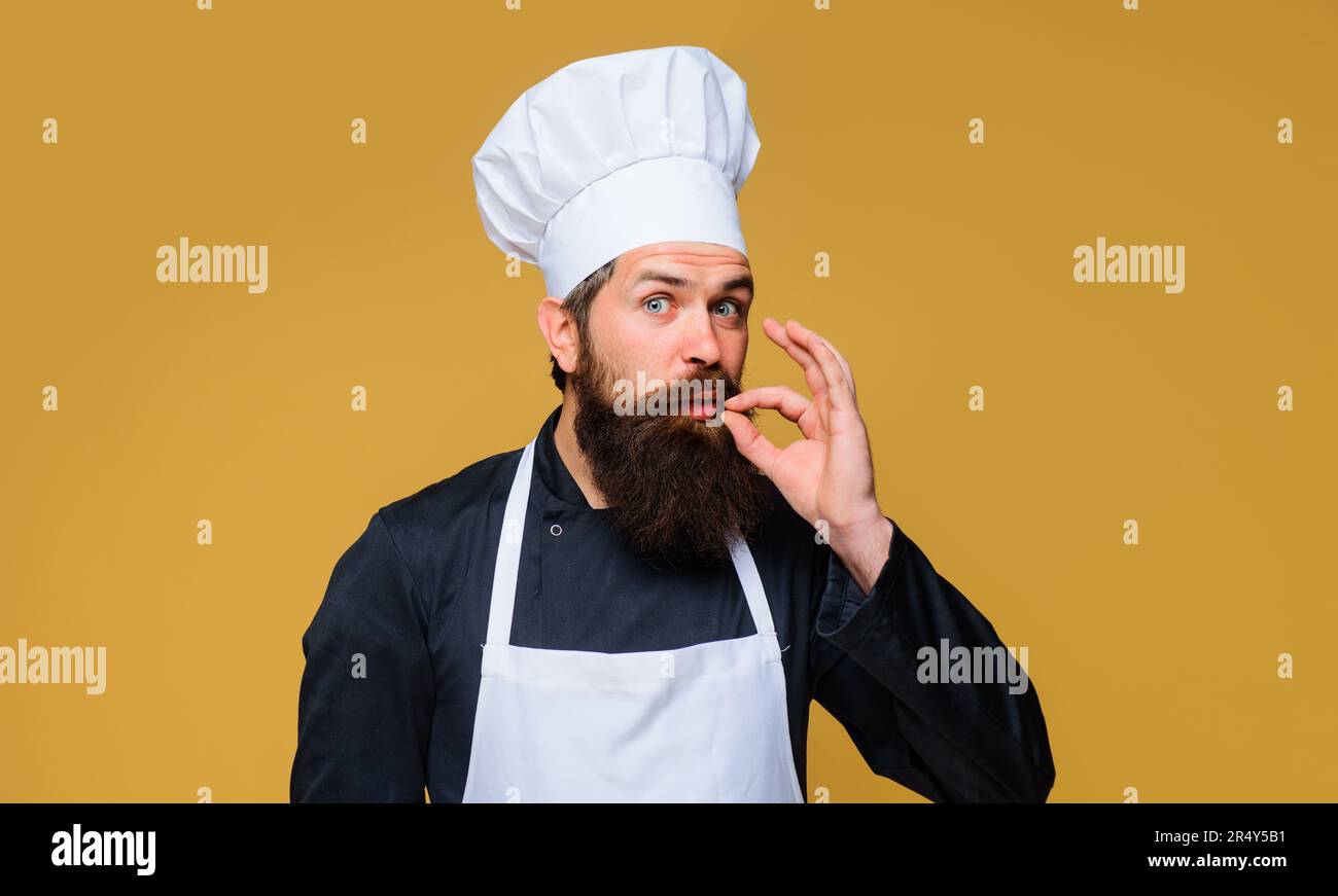 Professional chef showing sign for delicious. Cook in chef hat with ...