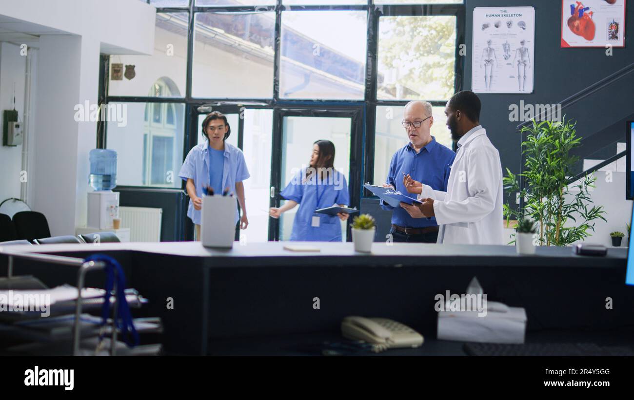 Patient in reception area hi-res stock photography and images - Alamy