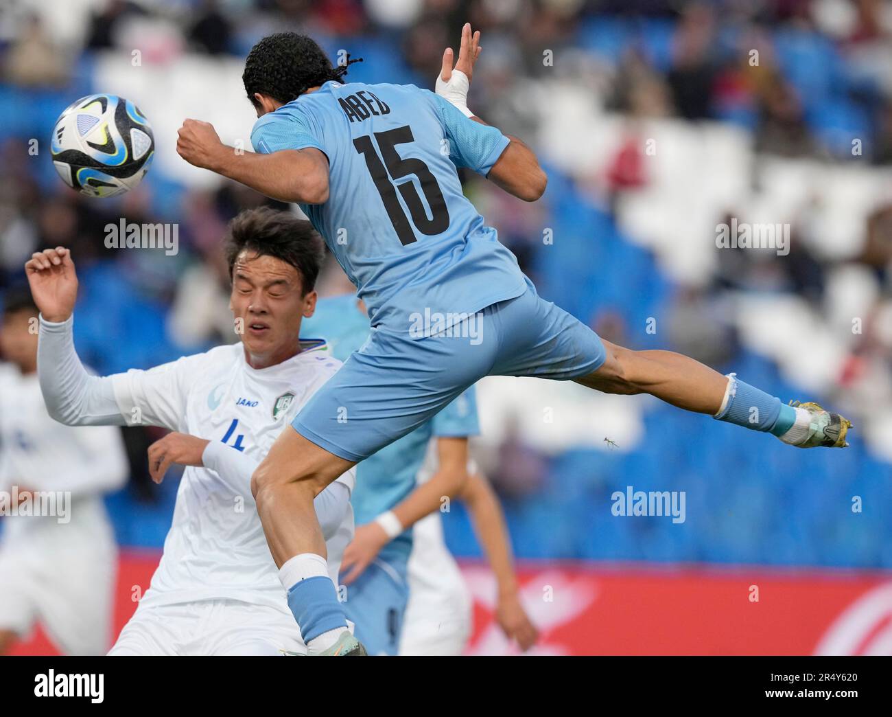 Israel's Tay Abed (15) takes a header over Uzbekistan's Abubakir ...