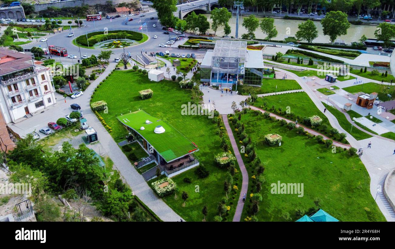 Part of Rike park in Tbilisi and Bridge of Metekhi and Kura river and ...