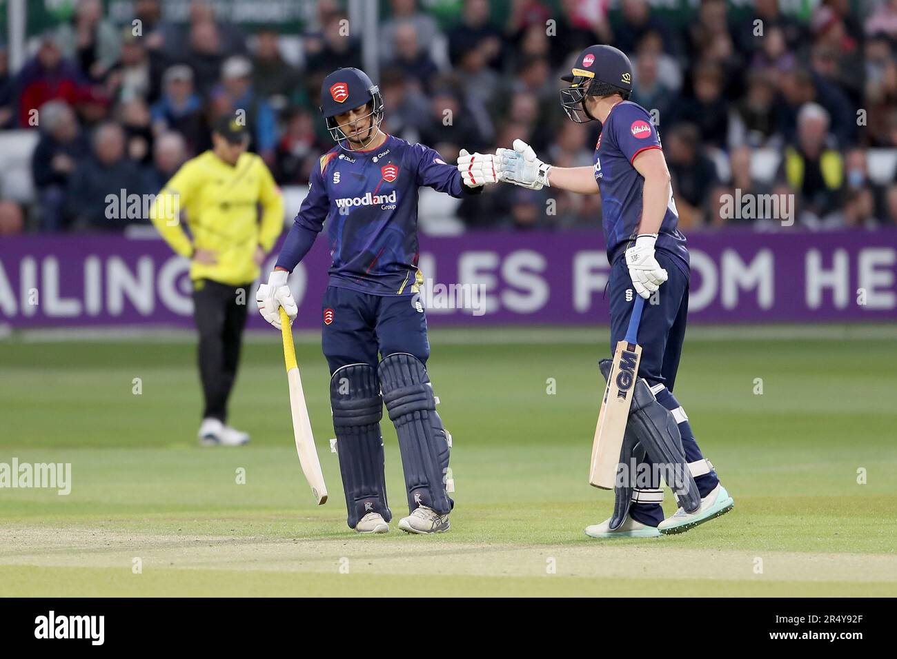 Robin Das of Essex is congratulated by Matt Critchley on reaching his ...