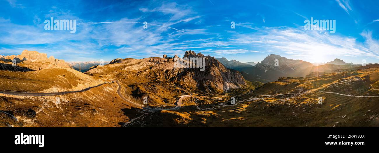 High stone columns of mountain massif of Tre Cime di Lavaredo at sunset ...