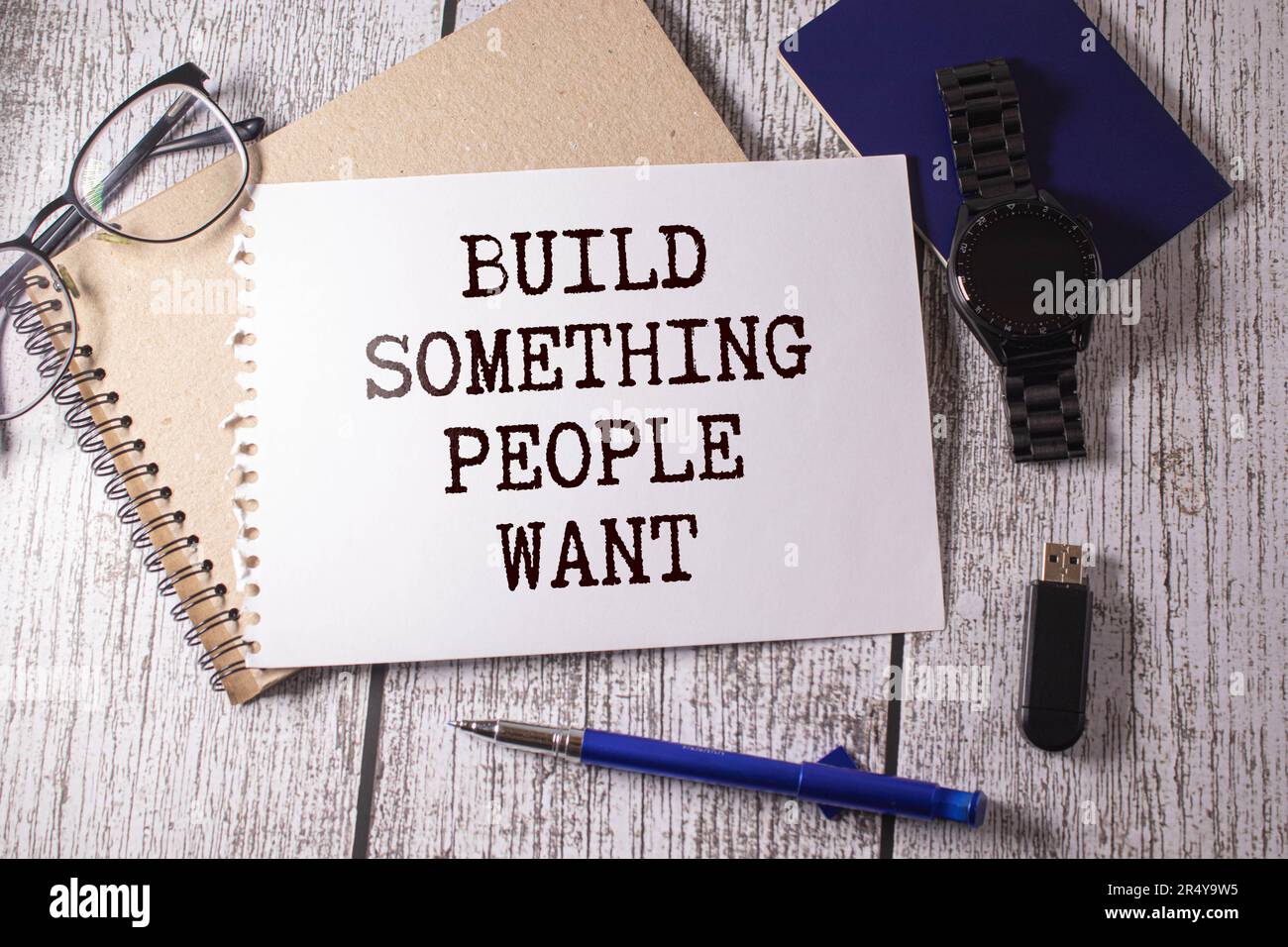 Build something people want.text on white notepad on craft background ...