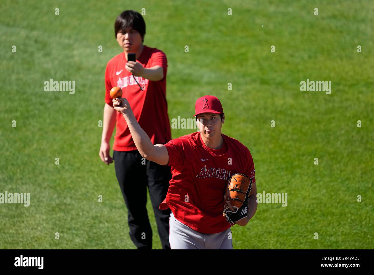Los Angeles Angels' Shohei Ohtani throws in right field as interpreter ...