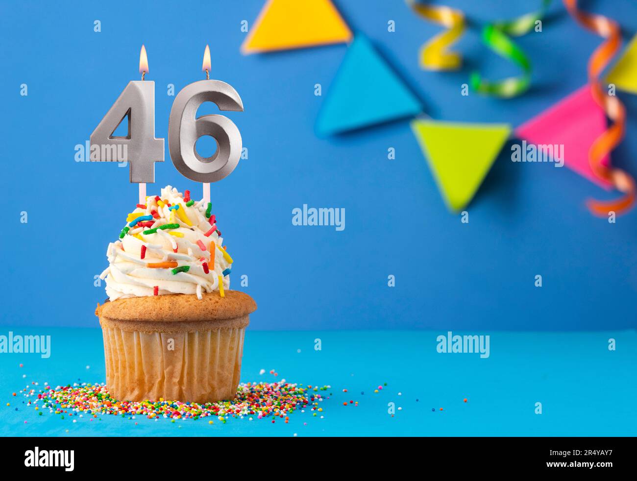 Candle number 46 - Cake birthday in blue background Stock Photo - Alamy