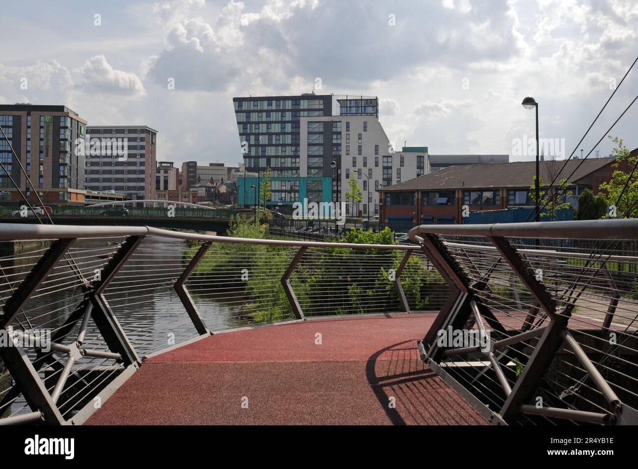 Looking at Sheffield City centre from the Cobweb bridge over the river ...
