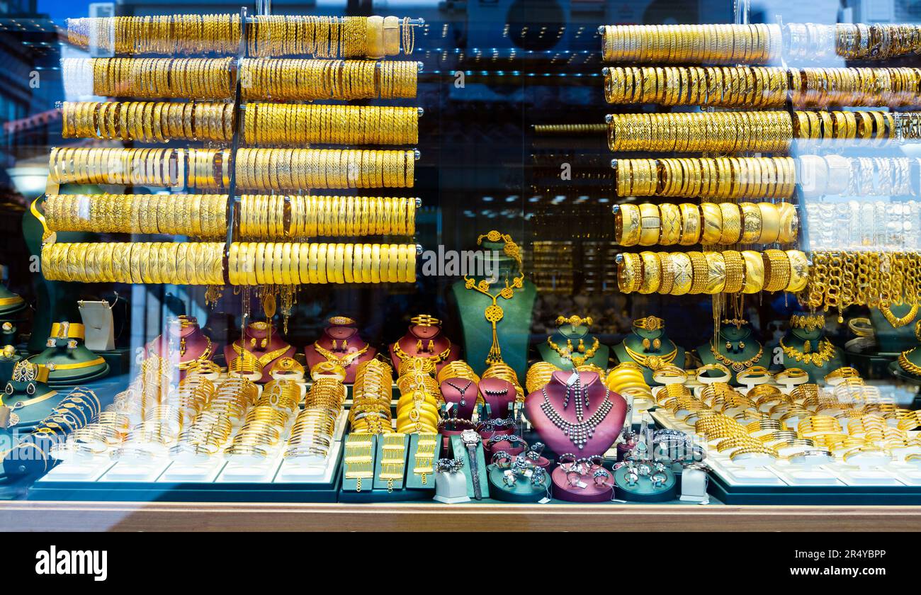 Gold jewelry on the counter of a jewelry store closeup Stock Photo - Alamy