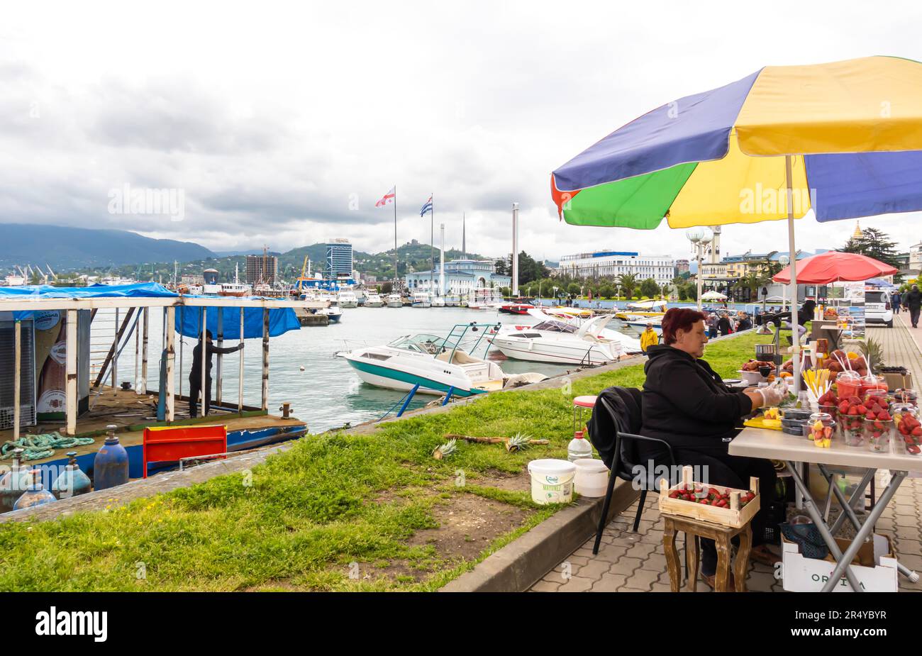 Fruit stall on promenade, seaside walking street , women selling fresh ...