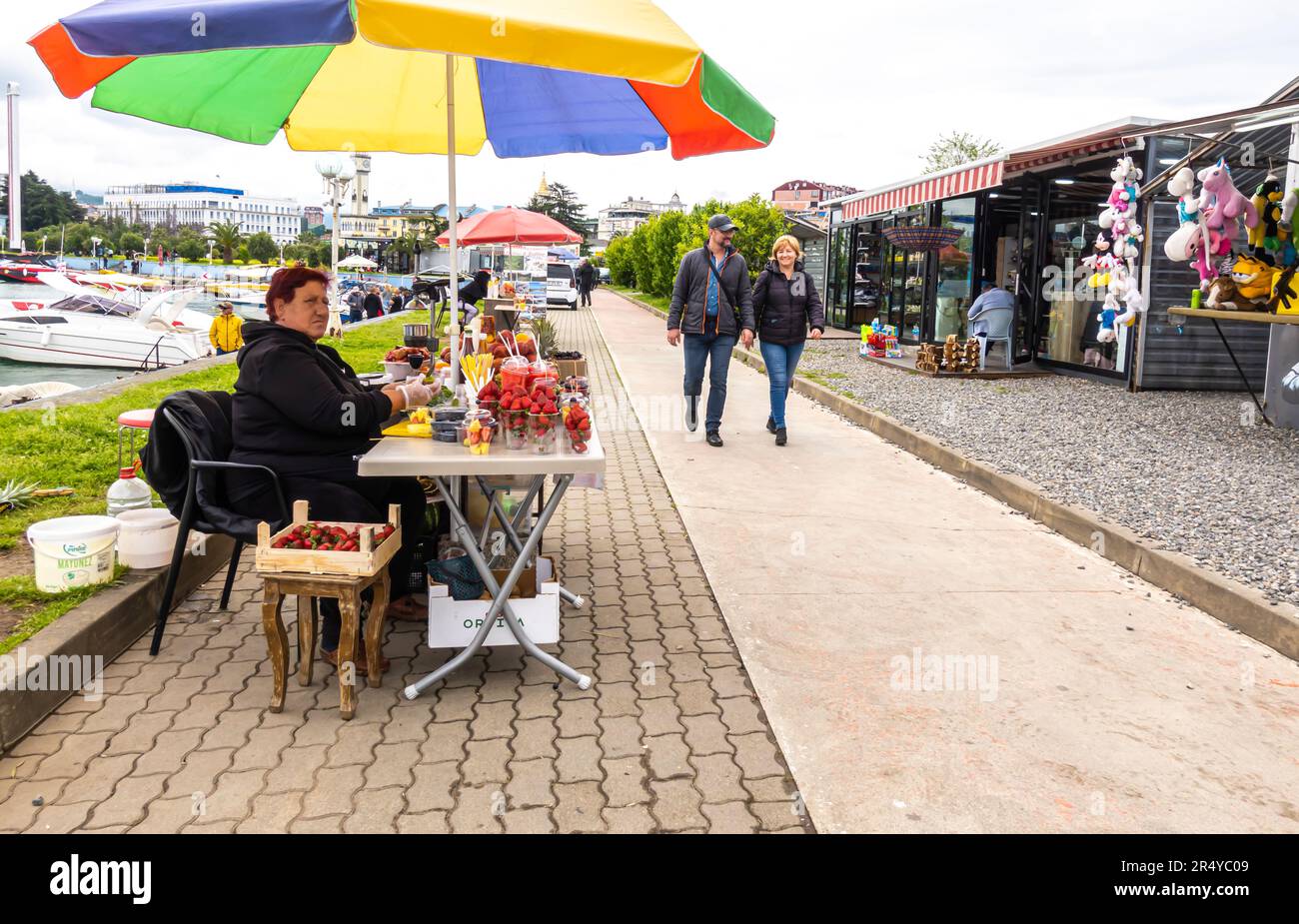Fruit stall on promenade, seaside walking street , women selling fresh ...