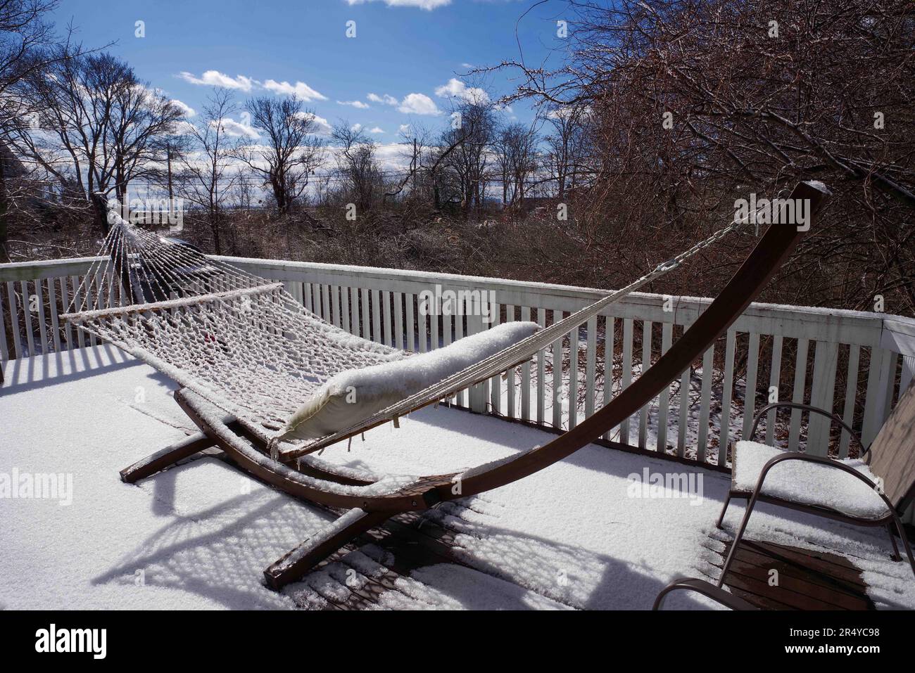 Macrame hammock on a snow covered residential deck Stock Photo - Alamy