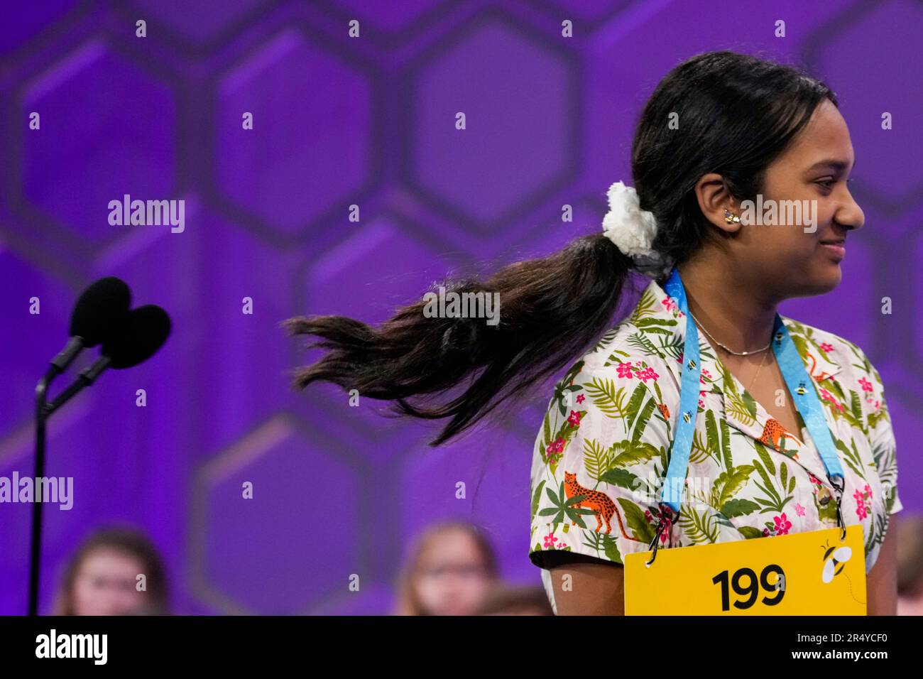 Ishika Varipilli, 12, from Spring, Texas, returns to her seat after ...