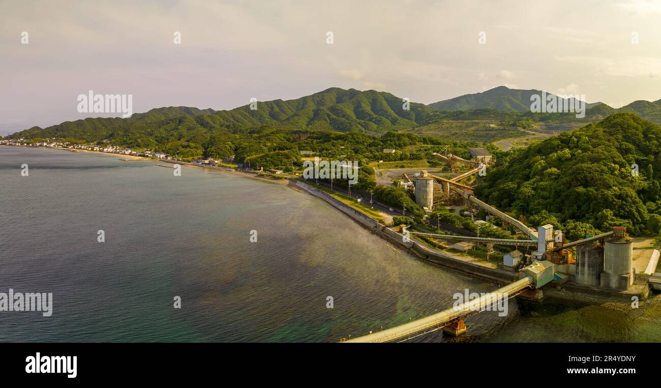 Aerial view of coastal material processing equipment and green ...