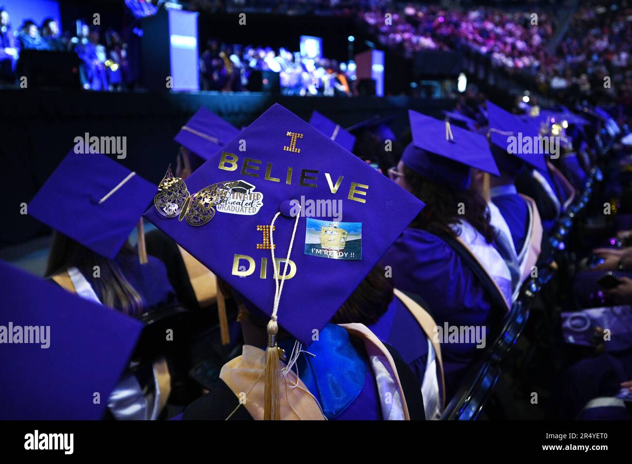 New York, USA. 30th May, 2023. A decorated cap is worn by a graduating ...