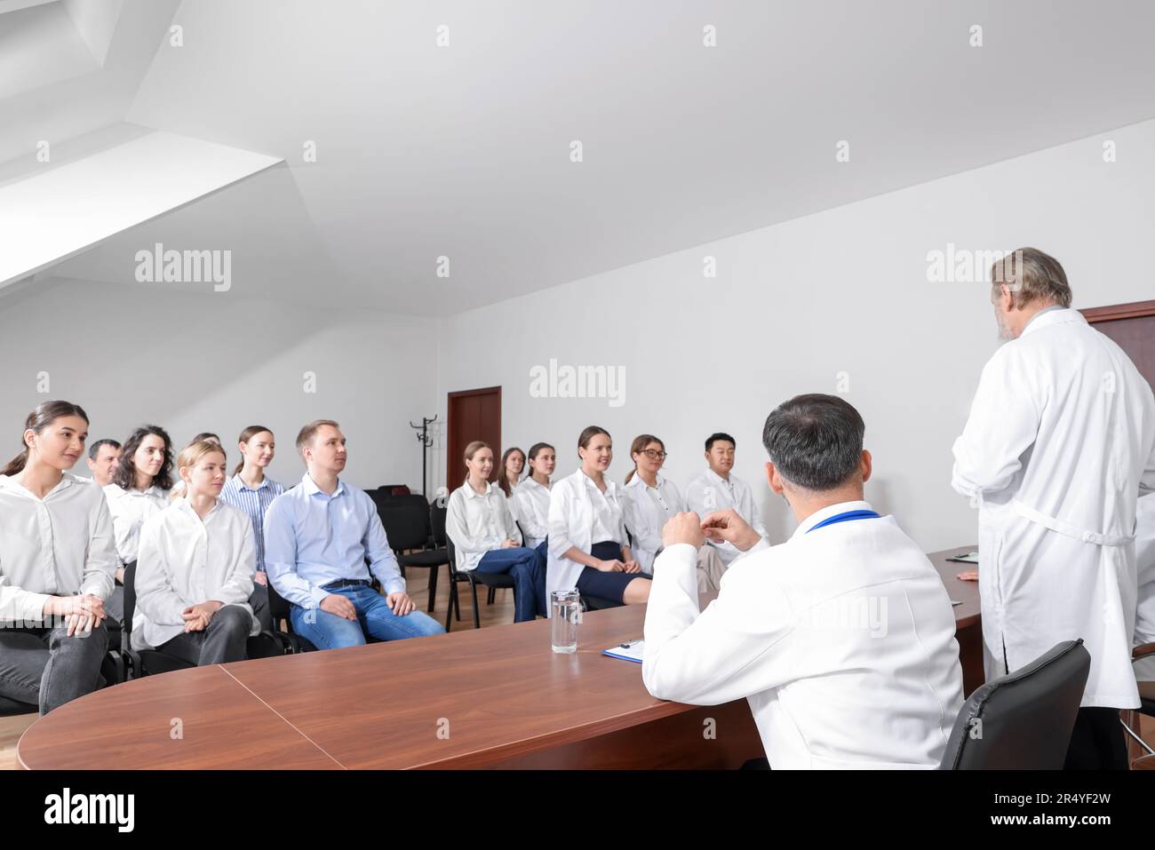Doctors giving lecture to audience on medical conference in meeting ...