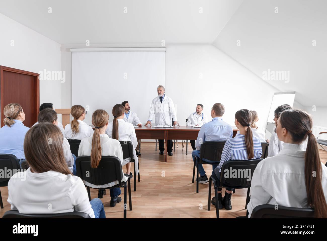 Senior female doctor giving lecture hi-res stock photography and images ...