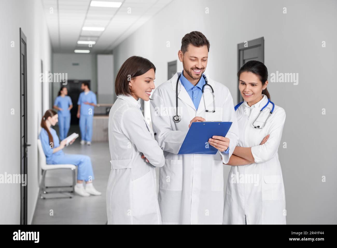 Team of medical students in college hallway Stock Photo - Alamy