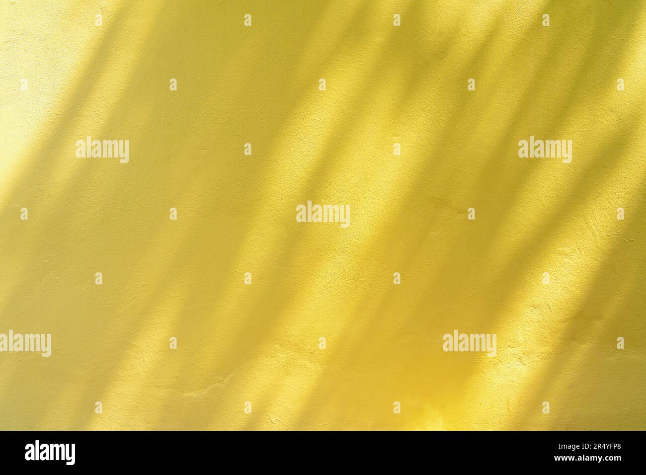 Natural shadow overlay on yellow colored grunge wall concrete texture ...