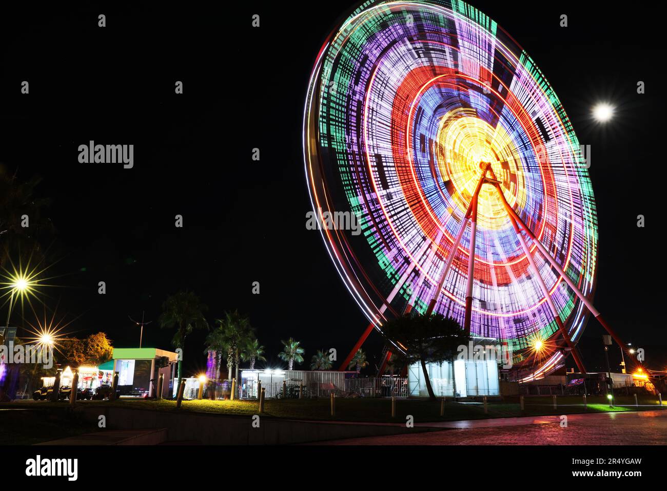 Beautiful glowing Ferris wheel against dark sky, space for text Stock ...