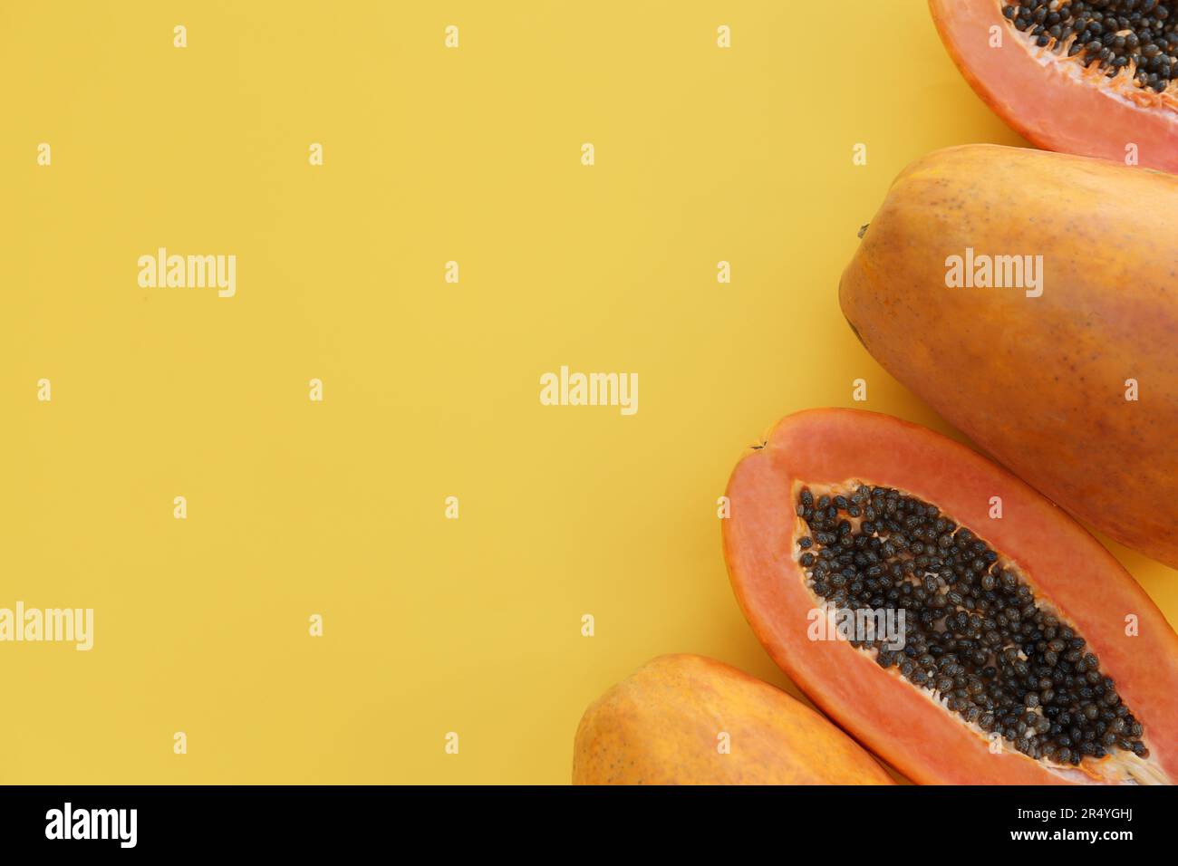 Fresh ripe cut and whole papaya fruits on light green background, flat ...