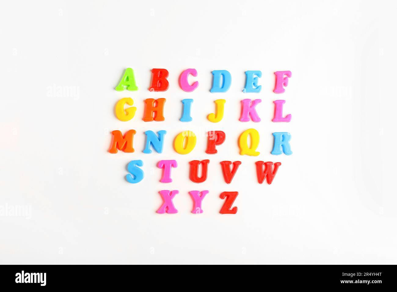 Colorful magnetic letters on white background, flat lay. Alphabetical ...