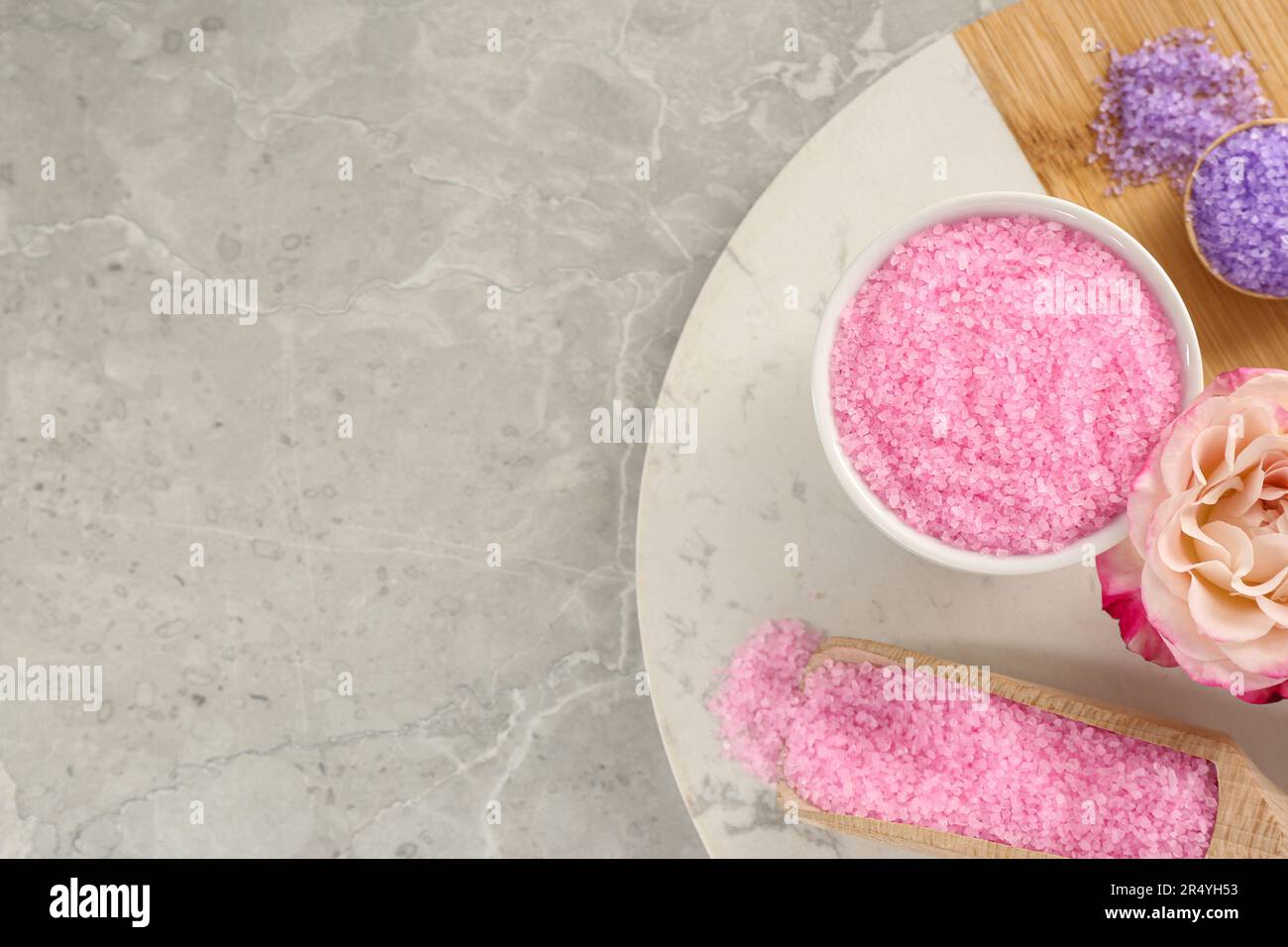 Sea salt and beautiful roses on light grey marble table, top view ...