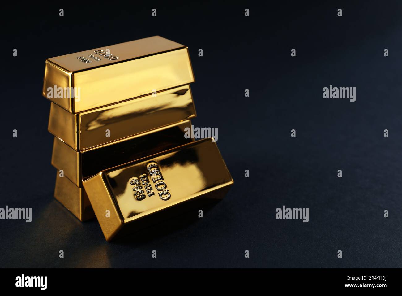 Many shiny gold bars on black background. Space for text Stock Photo - Alamy