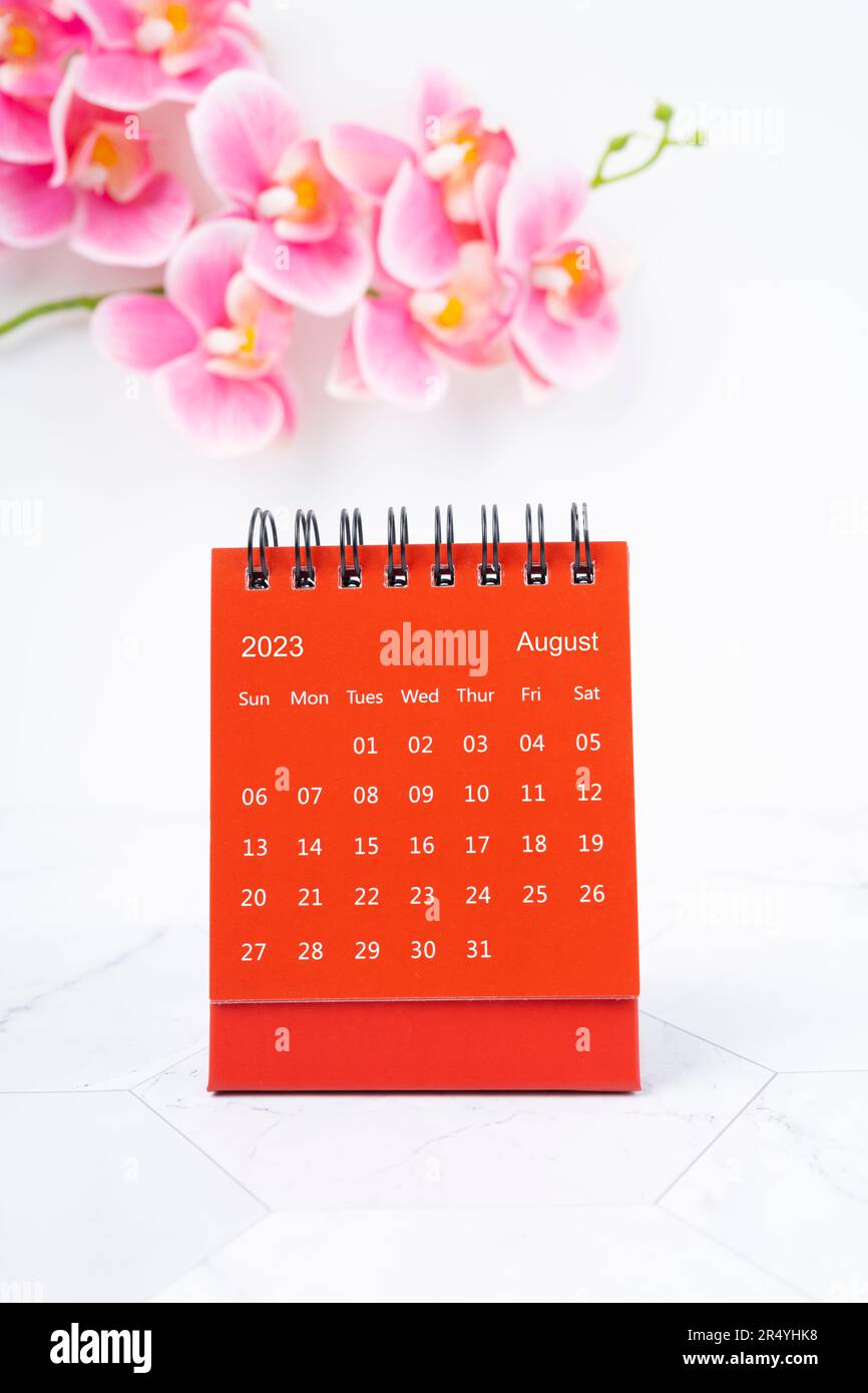 Red calendar August 2023. Desk calendar for year 2023 and pink orchid ...