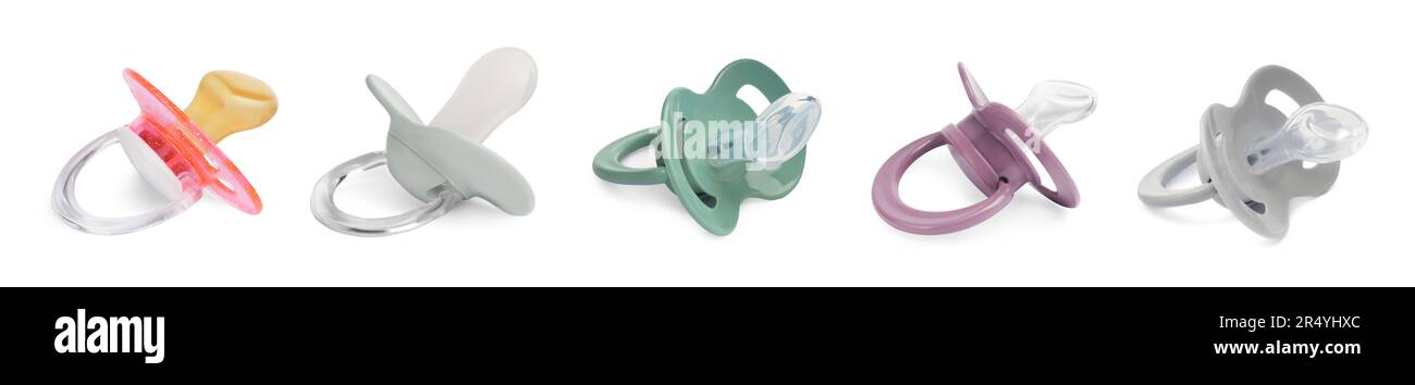 Set of different baby pacifiers on white background Stock Photo - Alamy