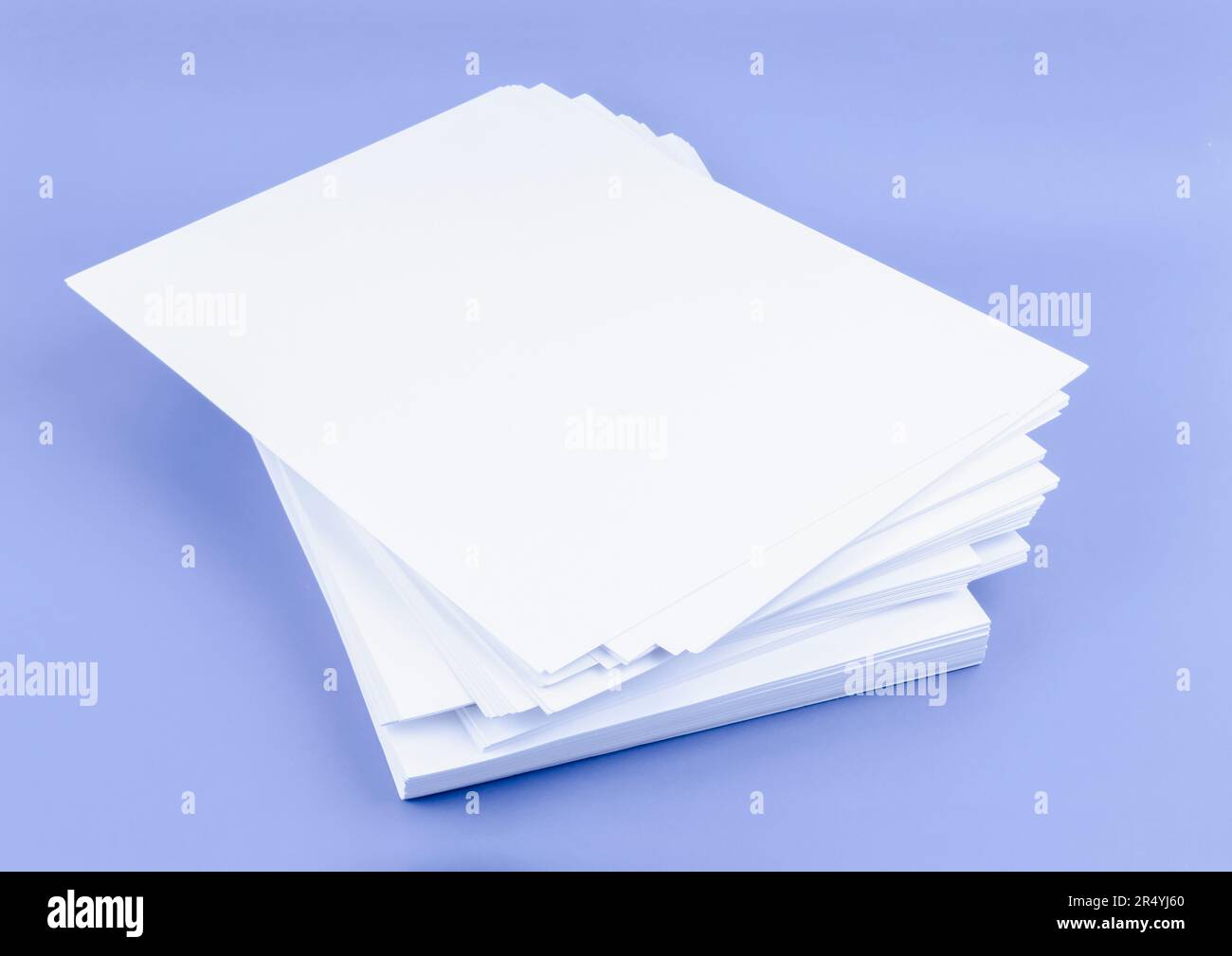 Stack of blank A4 paper sheets on blue background Stock Photo - Alamy