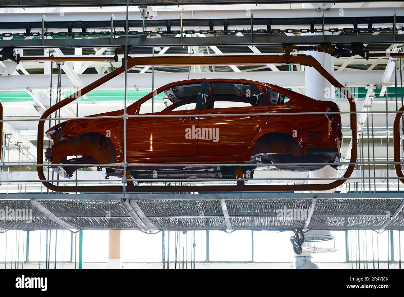 Car body transported by hanging conveyor in plant workshop Stock Photo ...