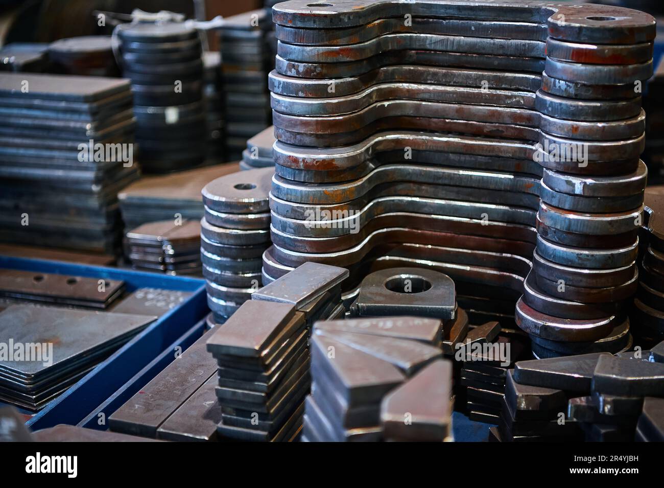 Group of workpieces cut of metal sheet in storehouse Stock Photo - Alamy