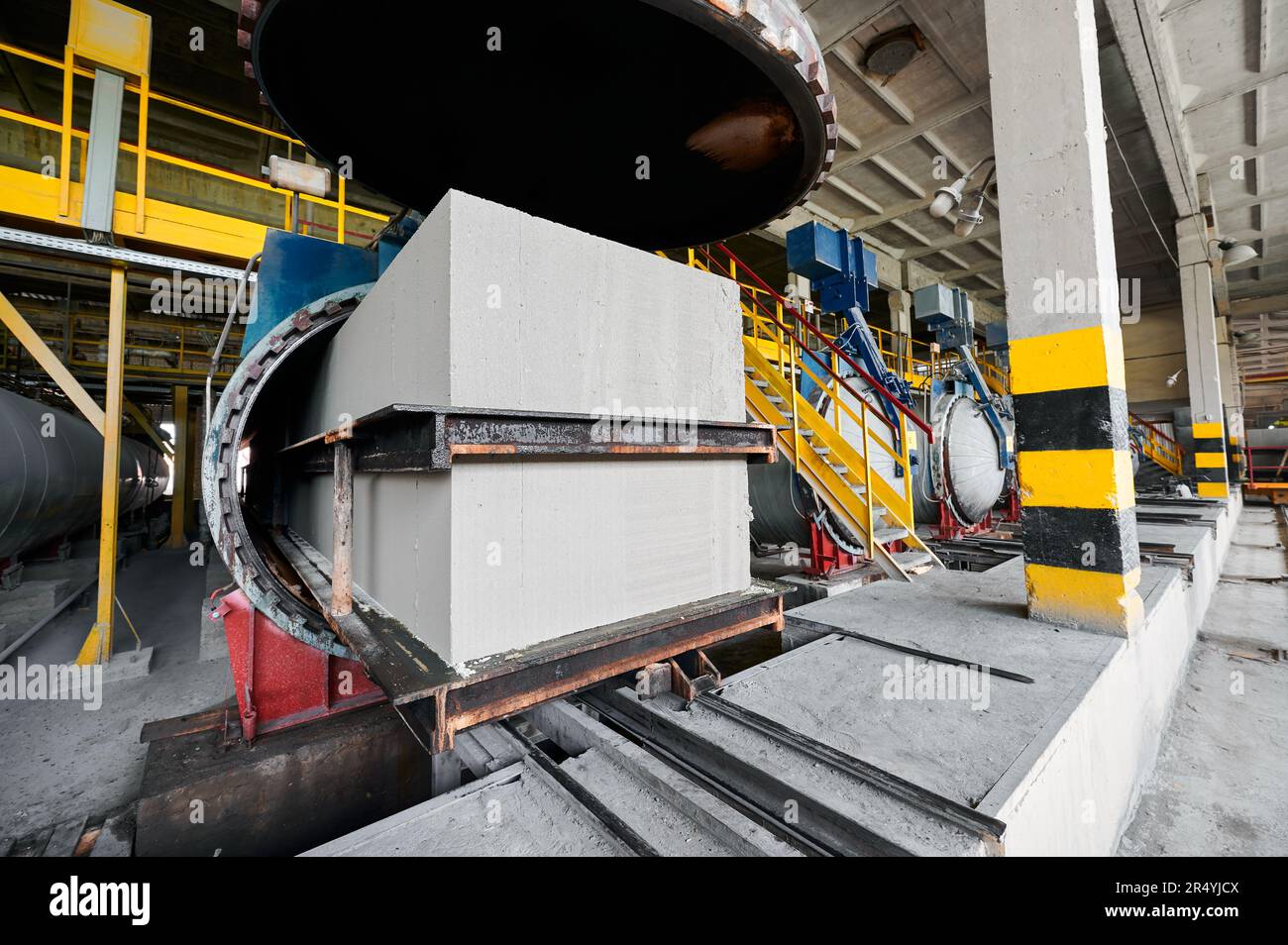 Raw brick blocks loaded into autoclaves at plant workshop Stock Photo ...