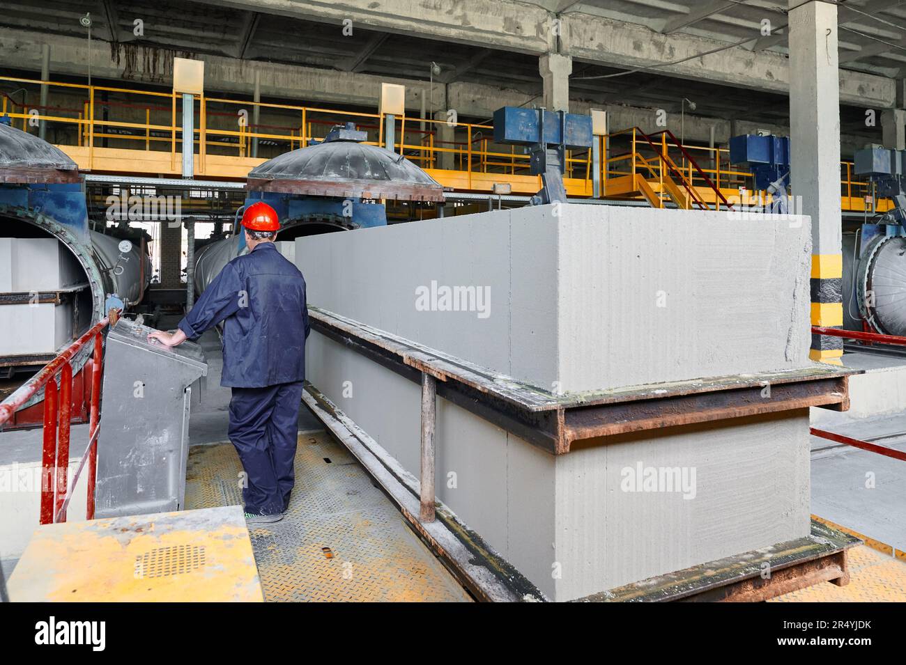 Loading of raw blocks into autoclave at manufacturing plant Stock Photo ...