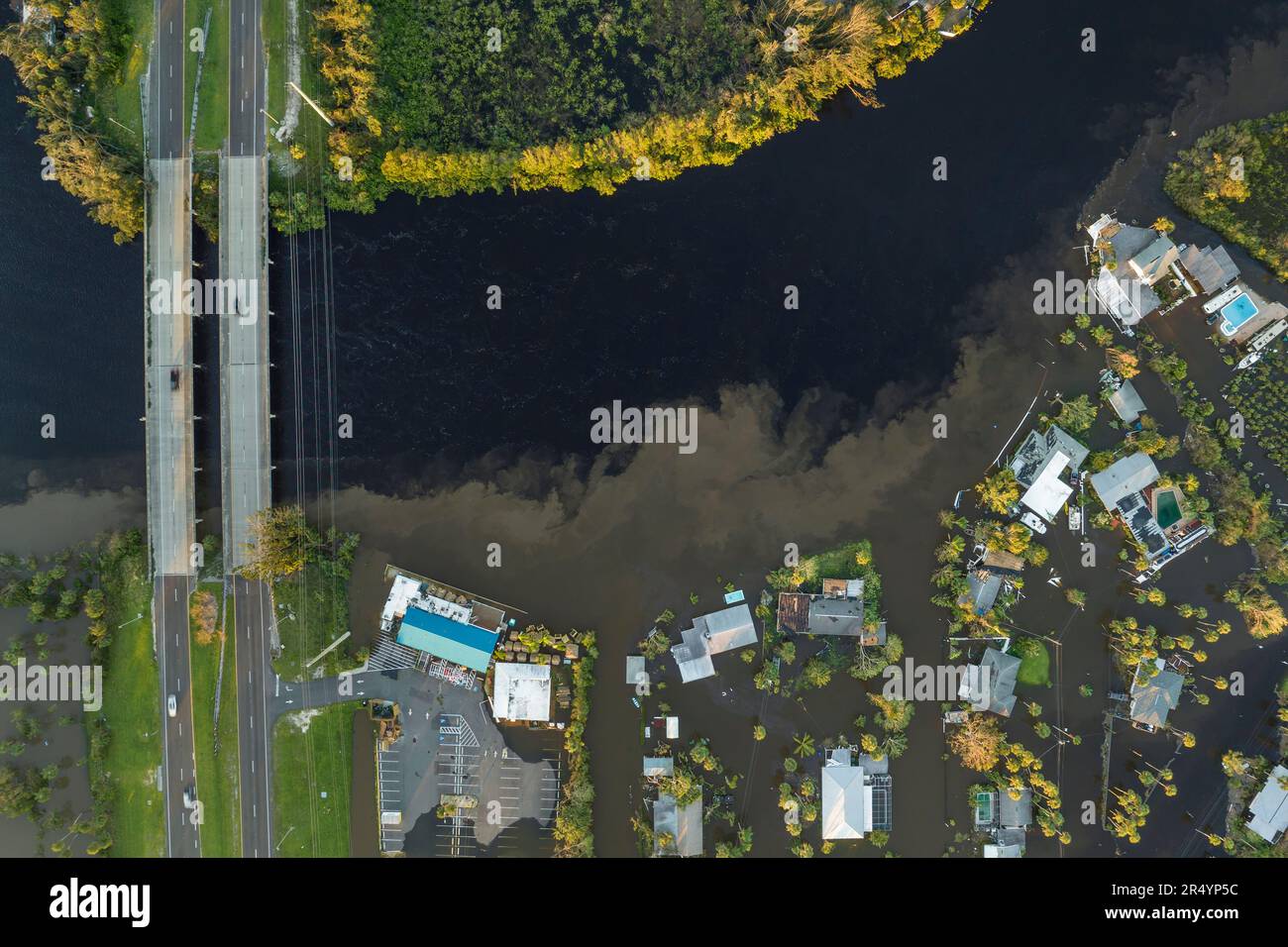 Aftermath of natural disaster. Flooded houses by hurricane Ian rainfall ...