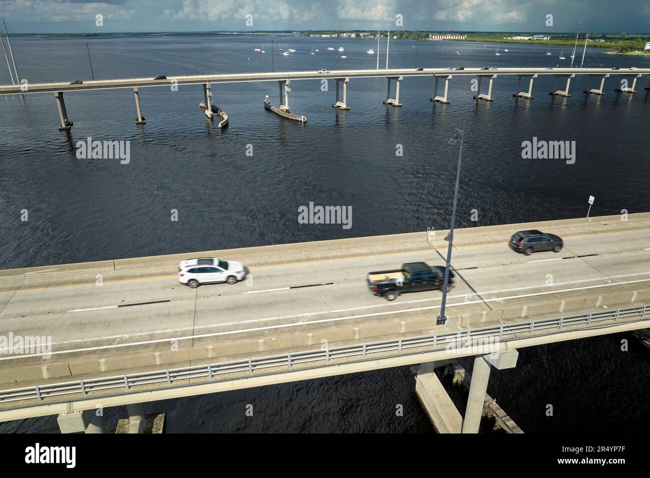 Barron Collier Bridge and Gilchrist Bridge in Florida with moving ...